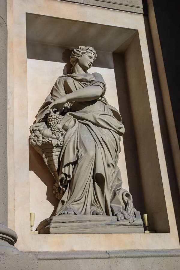 A Statue of a Woman Holding a Basket of Fruit Editorial Stock Photo ...