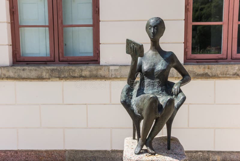 Statue of a Woman Reading in Front of the Library in Eutin Editorial ...