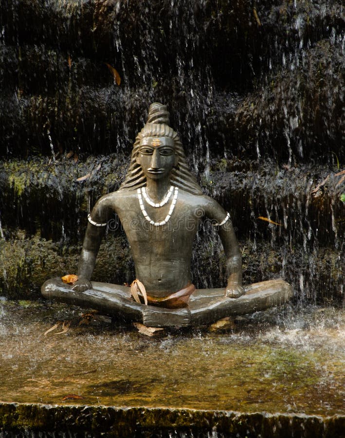 Statue of a yogi ar a park stock photo. Image of tree - 371614690