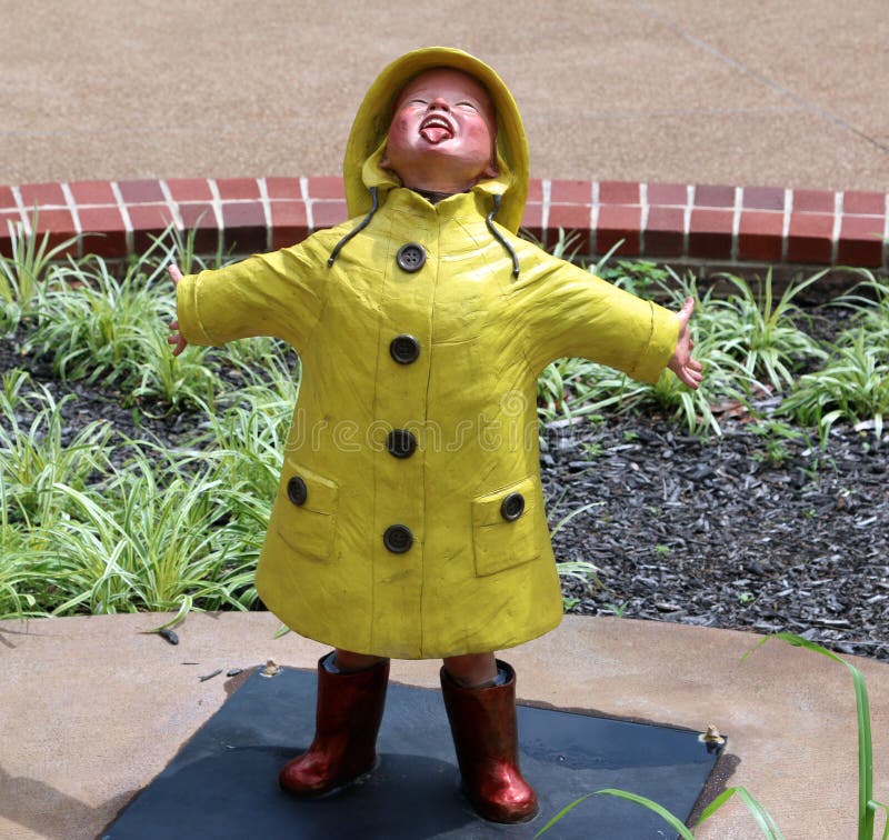 Statue of Young Child Splashing and Stomping in the Rain Stock Photo ...
