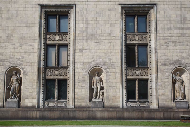Statues in Front of the Palace of Culture and Science in Warsaw, Poland ...