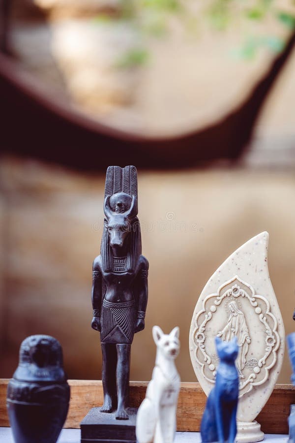 An Image of Various Statues in Front of Some Pots and a Vase Stock ...