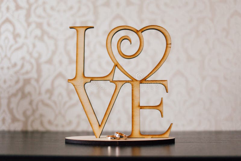 Statuette Love and Wedding Rings Stock Photo - Image of wooden, ring ...