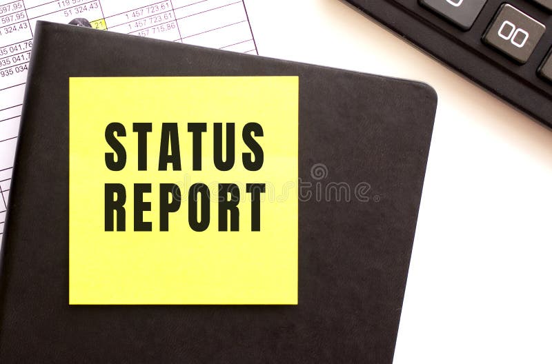 STATUS REPORT Text on a Sticker on Your Desktop. Diary and Calculator ...