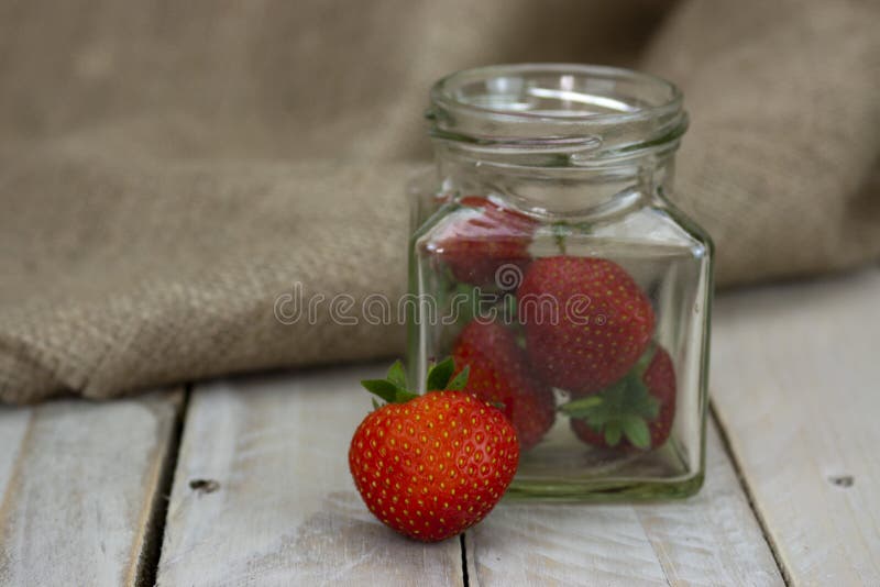 Stawberries in a Jar and Spilt on Table Stock Photo - Image of healthy ...
