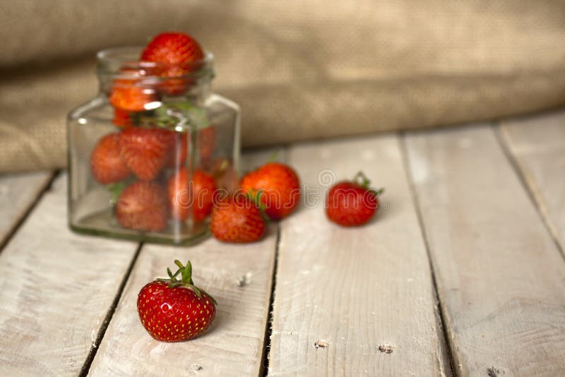 Stawberries in a Jar and Spilt on Table Stock Image - Image of ...