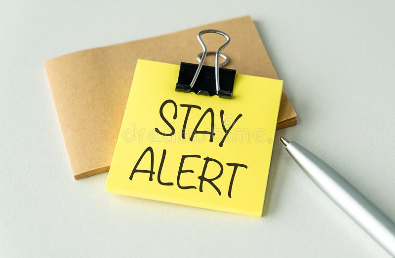 Stay Alert Text on Yellow Paper Card on White Background. Stock Photo ...
