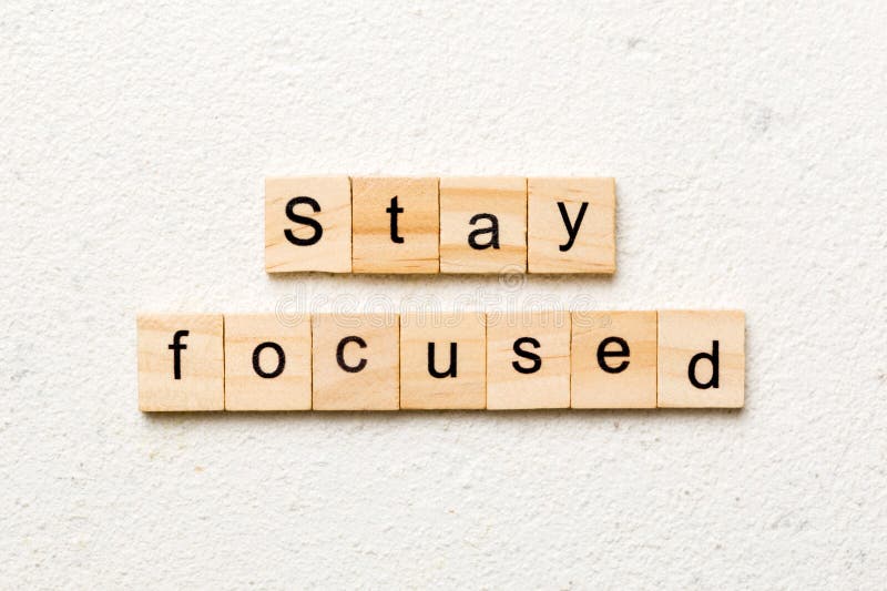 Stay Focused Word Written on Wood Block. Stay Focused Text on Table ...