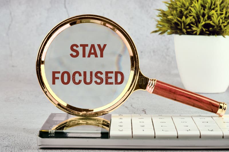 STAY FOCUSED Write through a Magnifying Glass on the Wall, Close-up ...