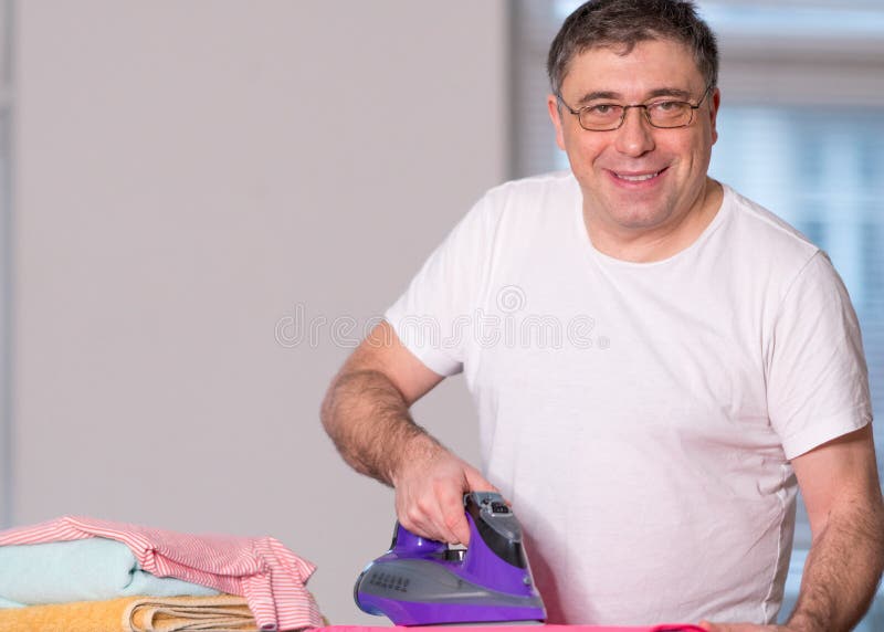 Stay-at-home dad ironing stock image. Image of laundry - 108728243