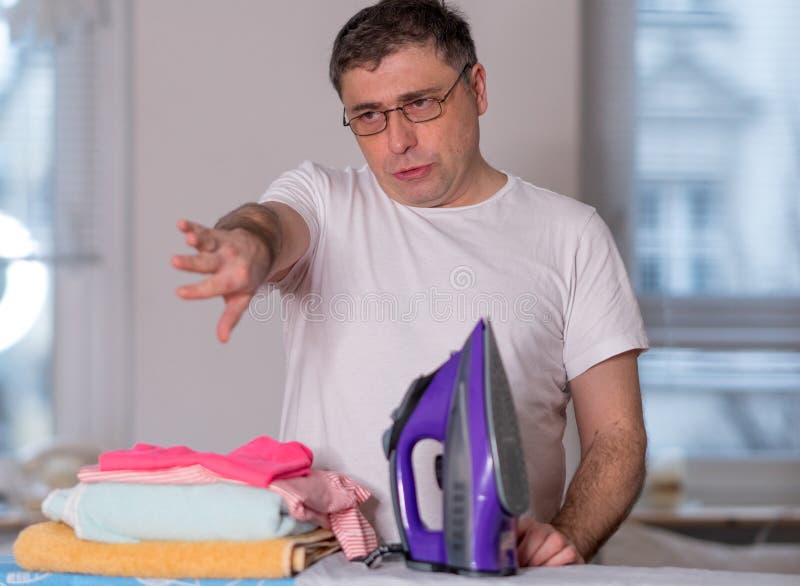 Stay-at-home dad ironing stock photo. Image of housework - 108728462