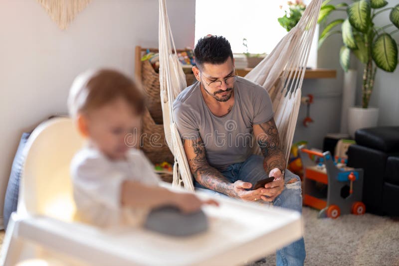 Stay at Home Dad on Smartphone Ignoring Child Stock Photo - Image of ...