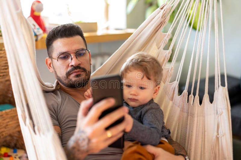 Stay at Home Dad on Smartphone Ignoring Child Stock Photo - Image of ...