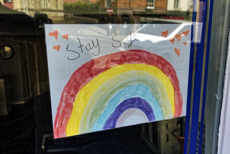 A Stay Safe from Coronavirus Rainbow Picture in a Shop Window Editorial ...