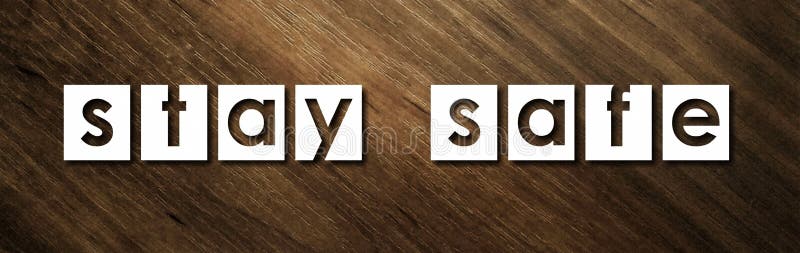 Stay Safe. Text Cut Out on White Rectangles with Shadow on Brown Wooden ...