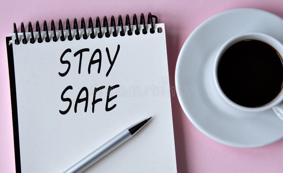 STAY SAFE - Words Written in a Notebook on the Background of a Cup of ...