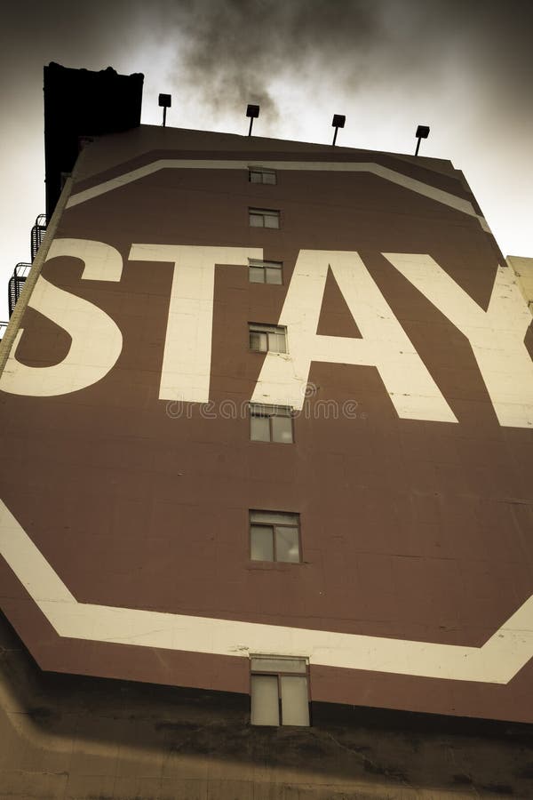 Stay Sign Painted on Building Stock Image - Image of arrow, direction ...