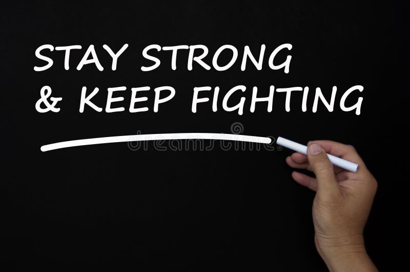 Stay Strong and Keep Fighting Text Written on Blackboard Using Chalk ...