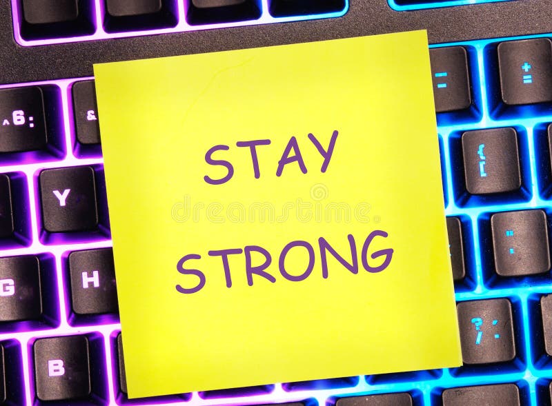 STAY STRONG Message Written on a Bright Yellow Sticker on a Colorful ...