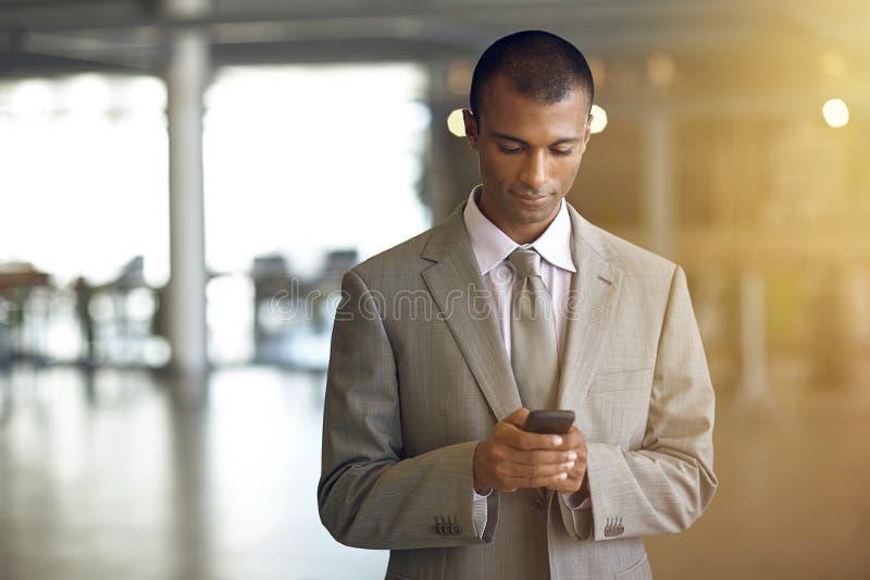 Staying Connected. a Businessman Sending a Text Message. Stock Photo ...