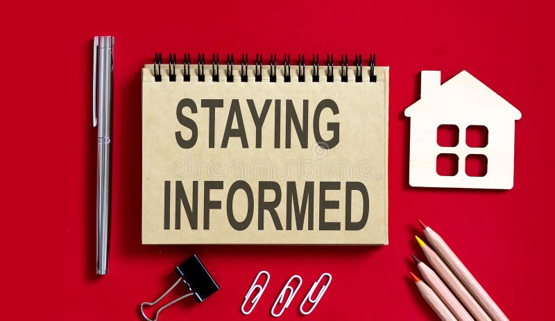 STAYING INFORMED Text Written on a Notebook with Pencils and Office ...