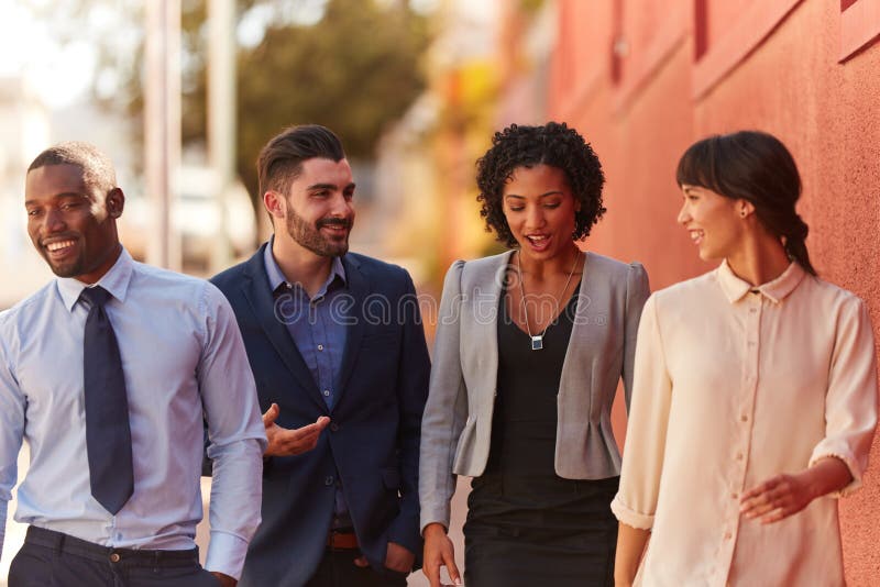 Staying on the Move As a Team. a Group of Businesspeople Walking in the ...