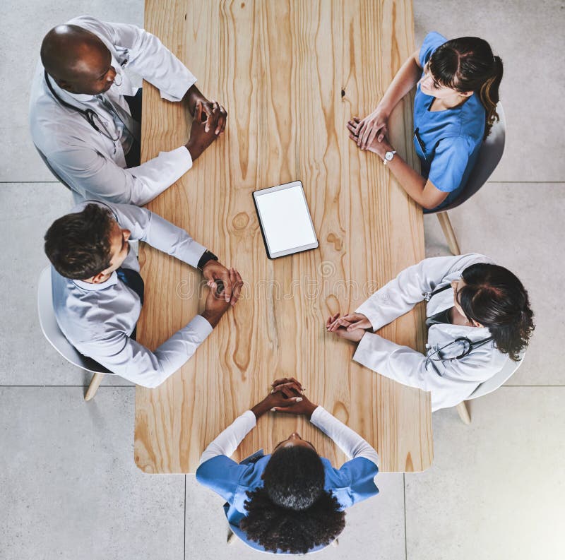 Staying on Top of Hospital Operations. a Group of Doctors Having a ... Staying on Top of Hospital Operations. a Group of Doctors Having a ...
