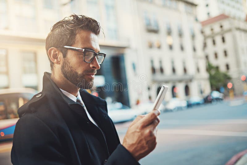 Staying in Touch Every Step of the Way. a Stylish Man Using His Phone ...