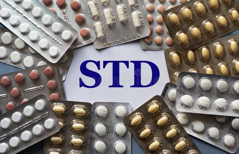 STD - Word on a White Sheet Against the Background of Tablet Plates ...