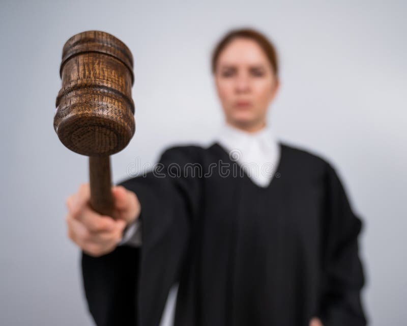 Steadfast Female Judge in a Robe Holding a Court Gavel. Stock Image ...