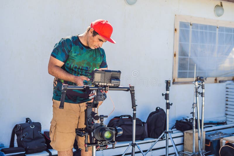 Steadicam Operator and His Assistant Prepare Camera and 3-axis ...