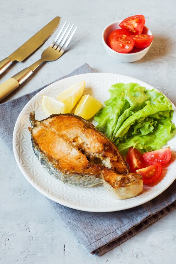 Steak Baked Salmon Fish on a Plate with Fresh Vegetables Stock Image ...