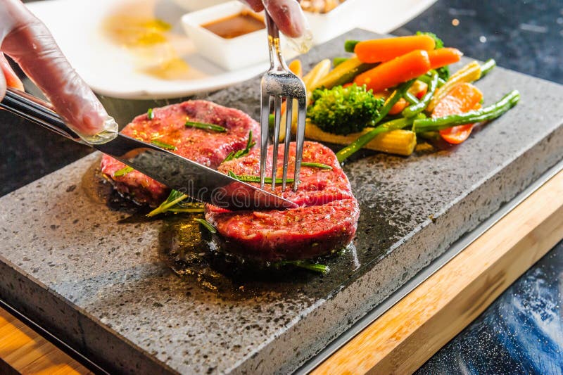 Steak cooked on lava-stone stock photo. Image of meat - 170882560