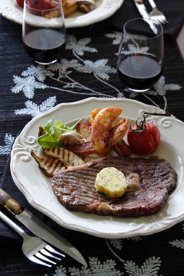 Steak dinner stock image. Image of herb, table, plate - 9947633