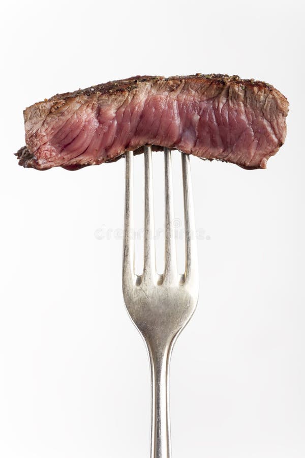 Steak on a fork stock photo. Image of background, brown - 12492200