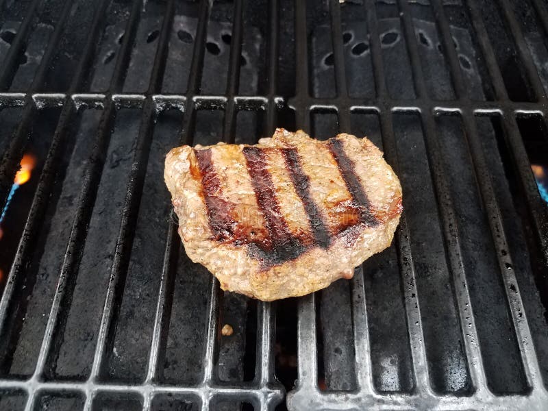 Steak with Grill Marks on Barbecue Grill Stock Image - Image of lines ...