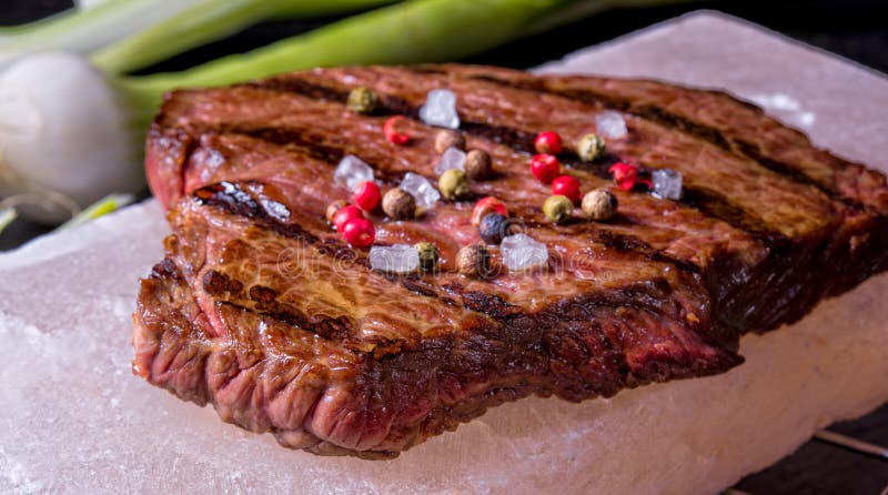 Steak on hot salt stone stock image. Image of polish - 95906977