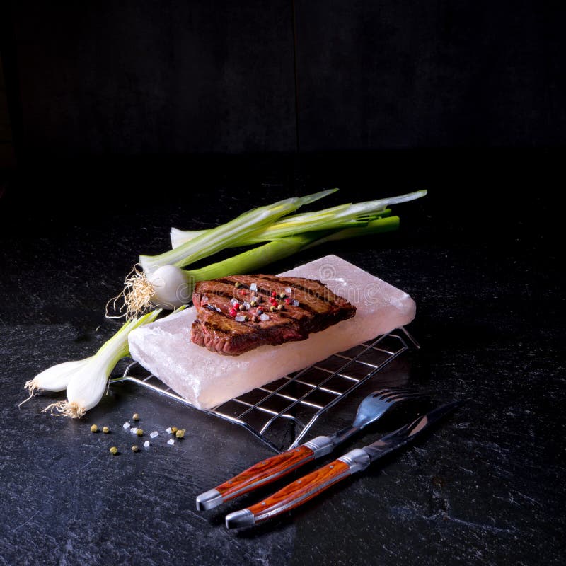 Steak on hot salt stone stock photo. Image of dark, cooking - 95907086