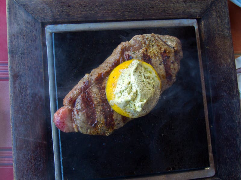 Steak on lava-stone stock photo. Image of stone, lemon - 18691932