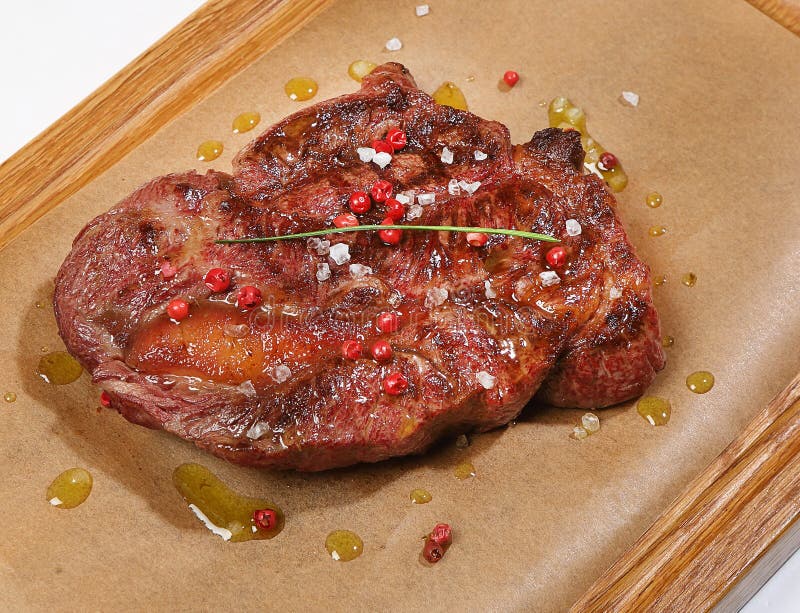 Steak of Marbled Beef, Garnished with Berries and Salt Stock Photo ...