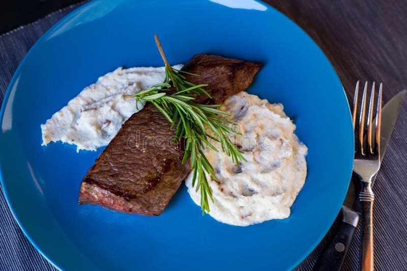 Steak and Mashed Potatoes Meal in a Blue Plate Stock Image - Image of ...