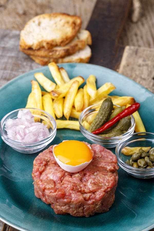 Steak tartare with egg stock image. Image of served - 205295419