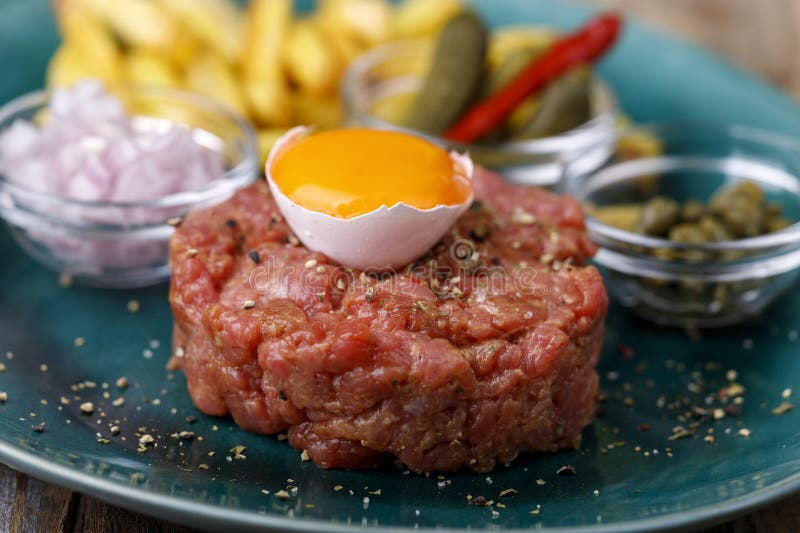 Steak tartare with egg stock image. Image of rustic - 272465065