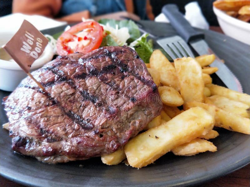 Steak with a Well Done Flag Stock Photo - Image of sauce, flag: 127892002
