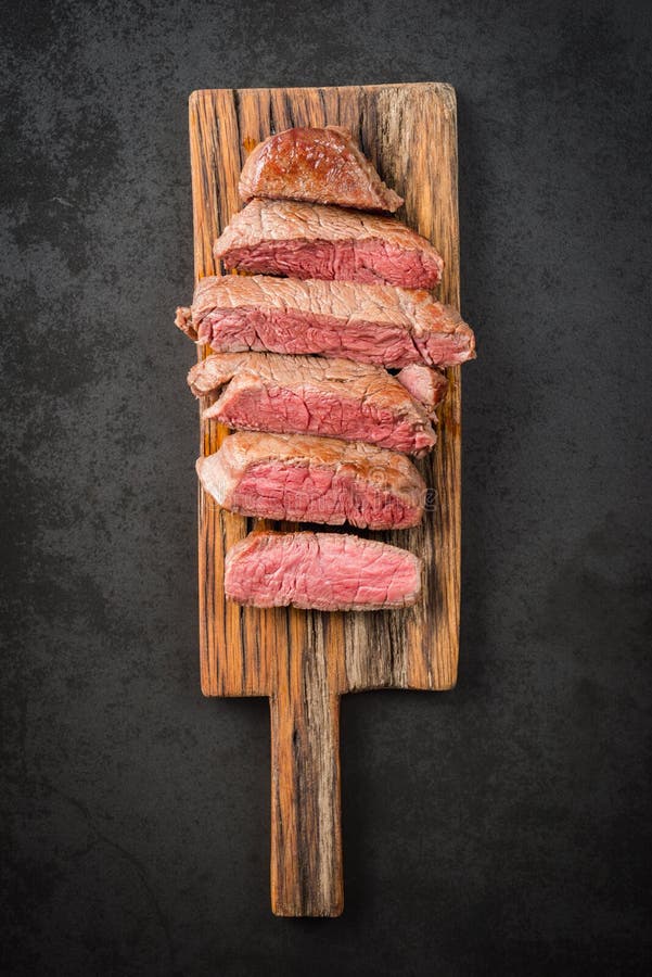 Steak on wooden board stock image. Image of fresh, steak - 77736251
