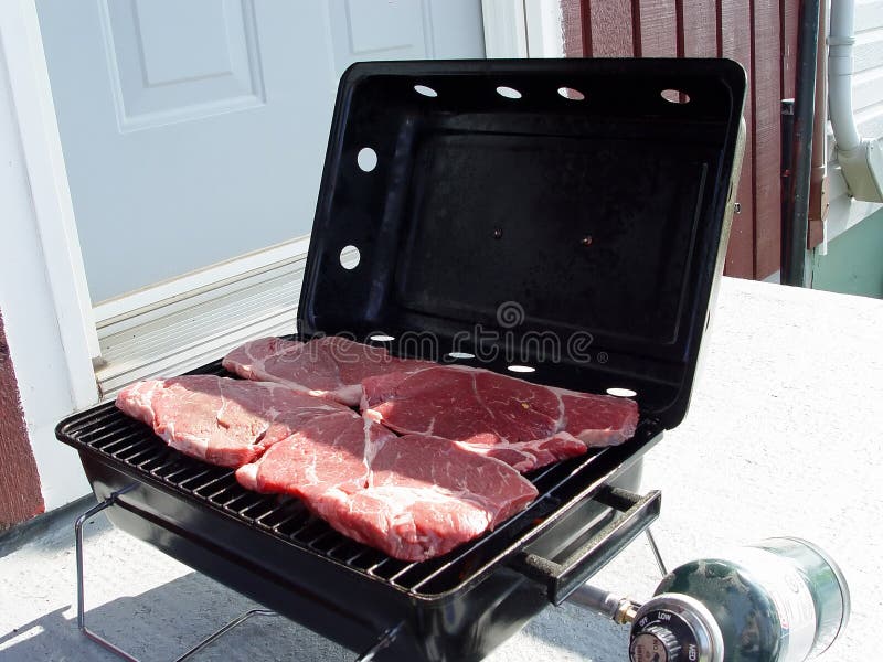 Steaks on a barbaque stock photo. Image of food, outdoors - 11808