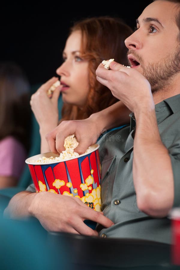 Stealing popcorn. stock image. Image of adult, food, eating - 33281699
