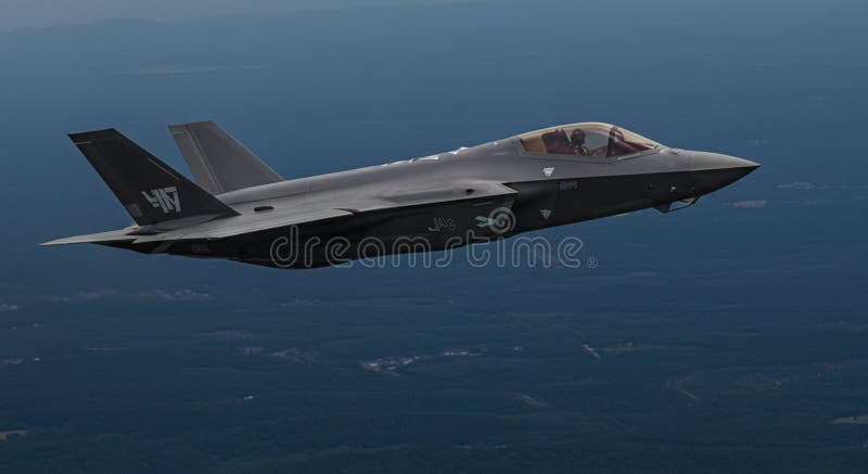 Stealth Fighter Jet, Likely an F-35, Captured in Flight. Sleek, Angular ...