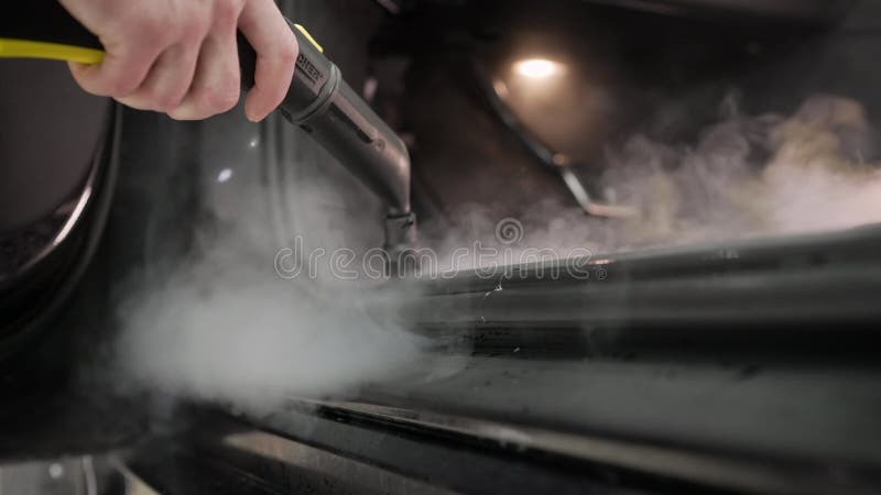 Steam Car Interior Cleaning. Car Wash, a Worker Cleans the Thresholds ...