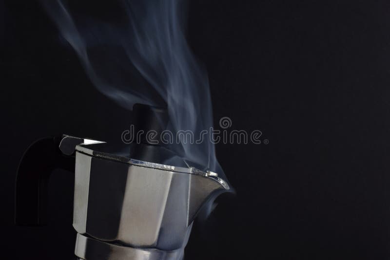 Steam of Coffee Boiling in a Moka Pot in the Black Background with Copy ...